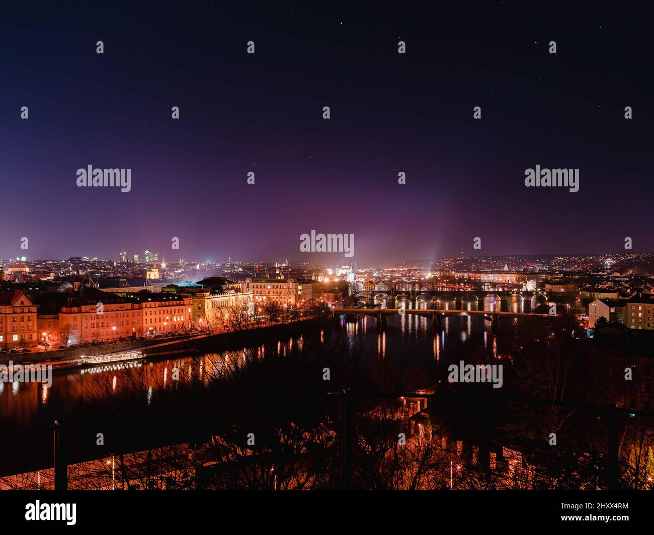 Panoramic scene of a night view of city lightful buildings, bridges and ...