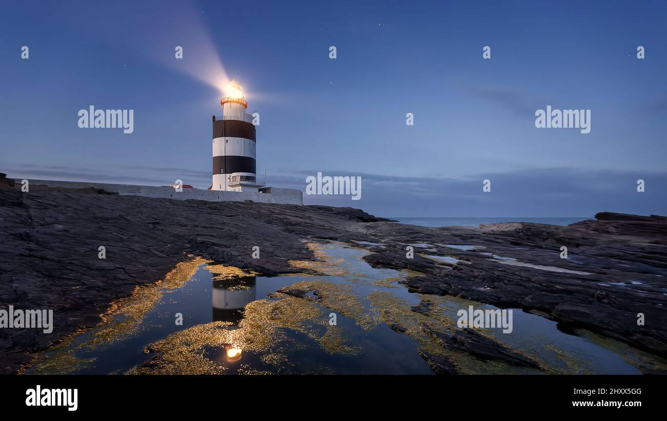 Evening scene of the Hook Head Lighthouse in County Wexford, Ireland ...