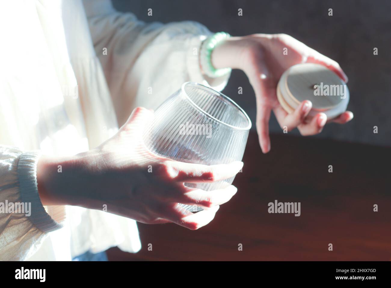 Hand and lid hi-res stock photography and images - Alamy