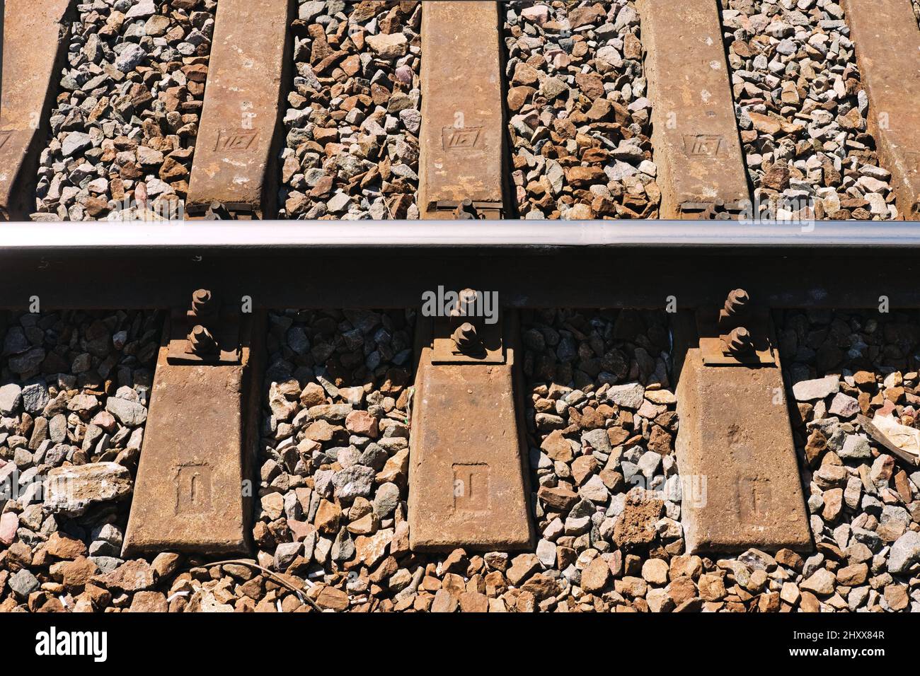 Close-up photo of railway track, sleepers and rails. Railroad trip ...
