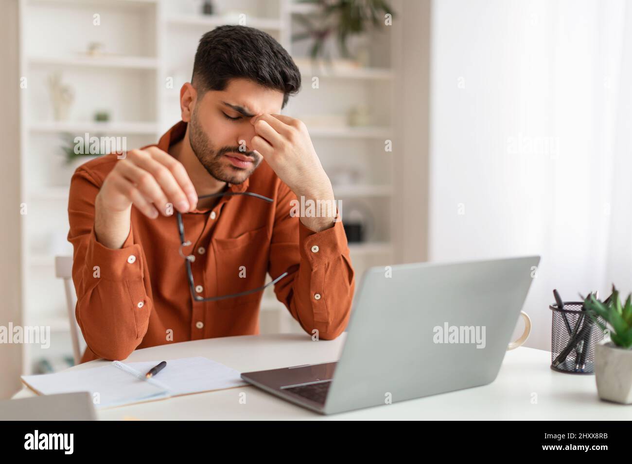 Arab businessman bored desk hi-res stock photography and images - Alamy