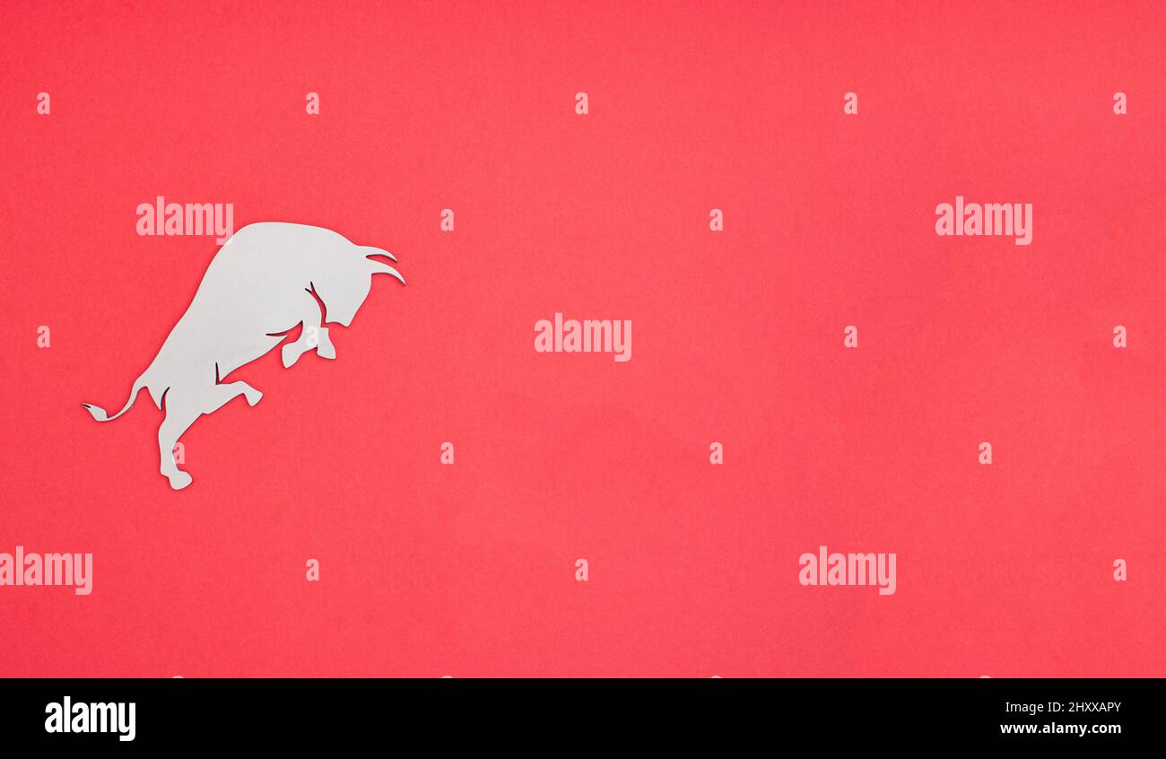 Gray bull isolated on red background with copy space Stock Photo - Alamy