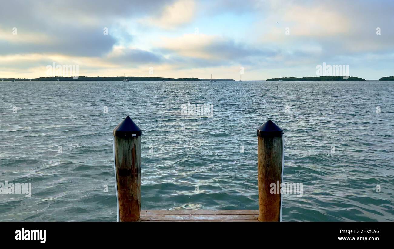 Beautiful jetty on the calm water of the Florida Keys Stock Photo - Alamy