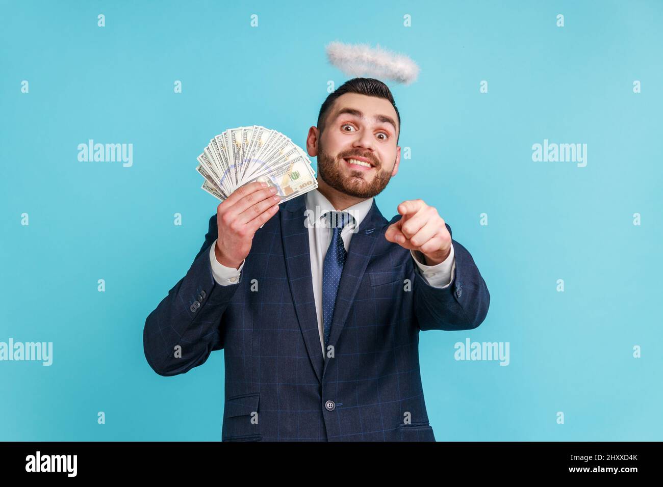 Man wearing official style suit with halo over head pointing at camera ...
