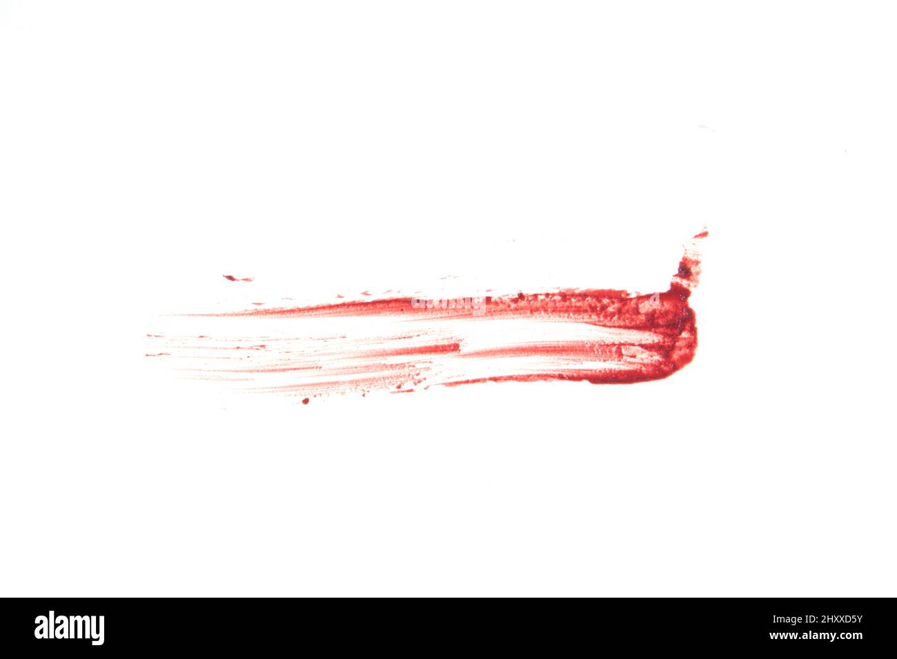 The smear and texture of lipstick. The pink color is highlighted on an ...