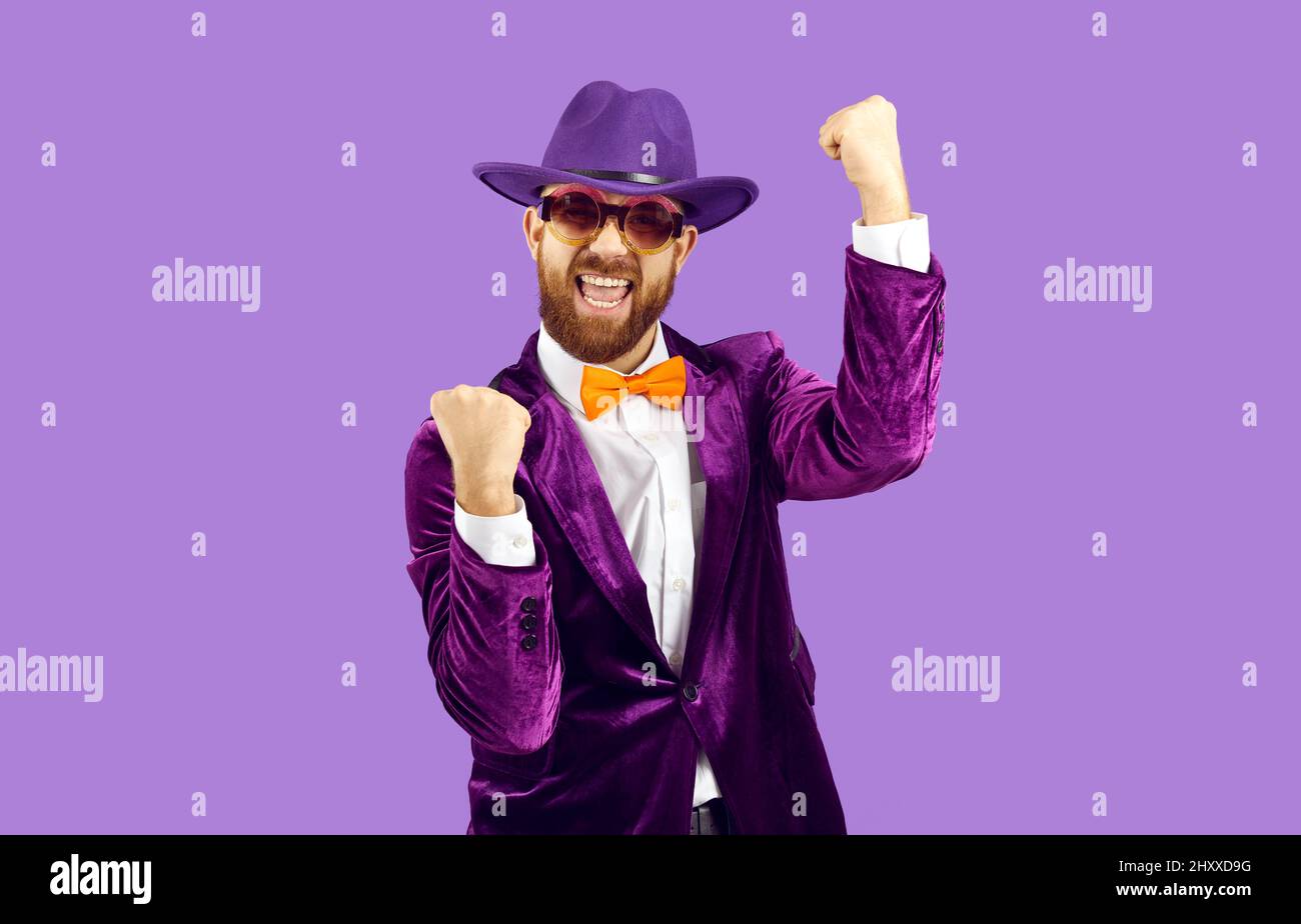 Excited man in funny costume celebrating his success, shouting Yes and ...