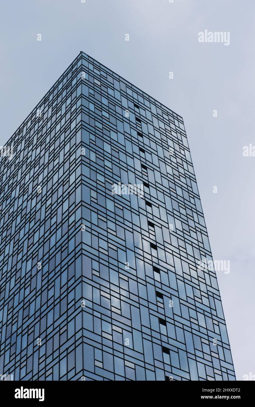 High rise building against the sky in metropolis. Tall and glass ...