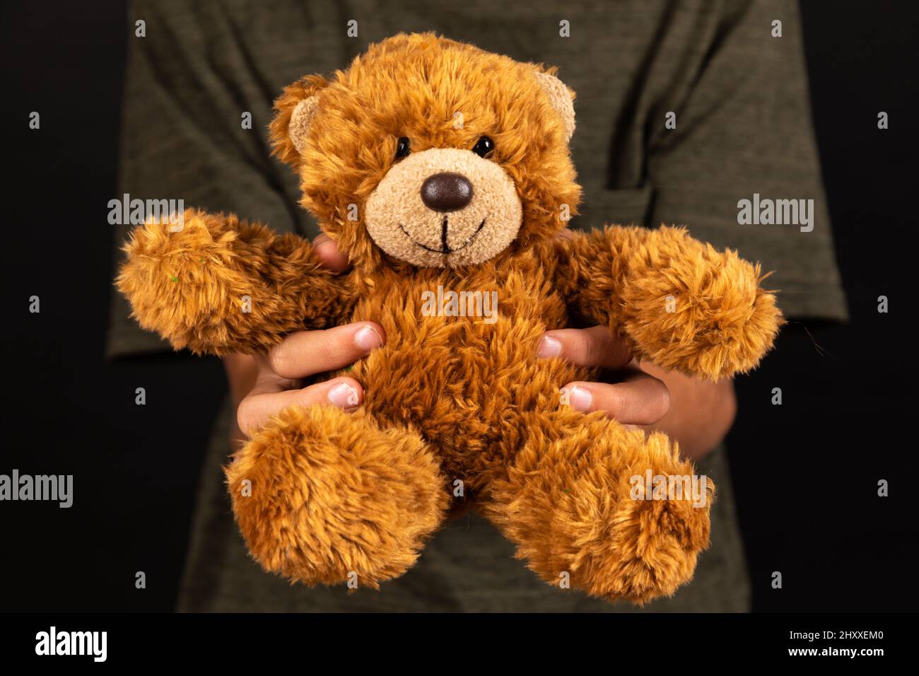 Holding hands with a teddy bear hi-res stock photography and images - Alamy