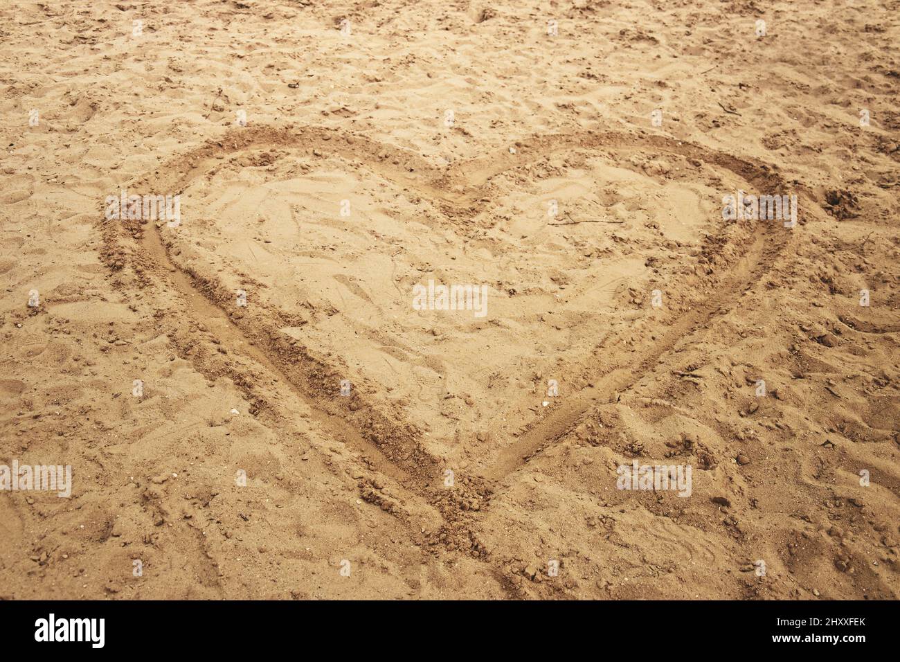 Drawing heart in the sand hi-res stock photography and images - Alamy