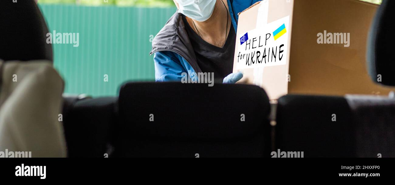 Box with donation clothes for ukrainian refugees suffering from war ...