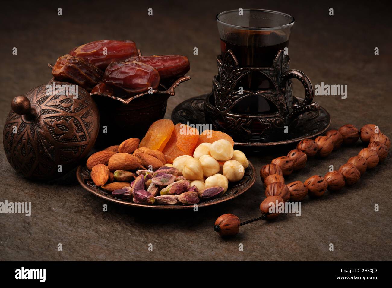 Dried fruits nut mix and arabic tea Stock Photo - Alamy
