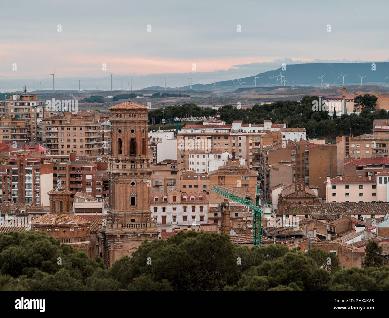 Old buildings and wind turbines in the background in Spain Stock Photo ...