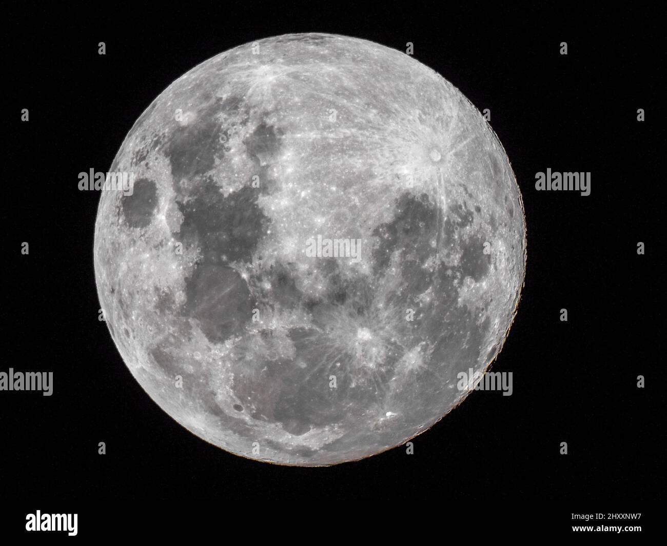 Grayscale shot of the full moon on a dark background Stock Photo - Alamy