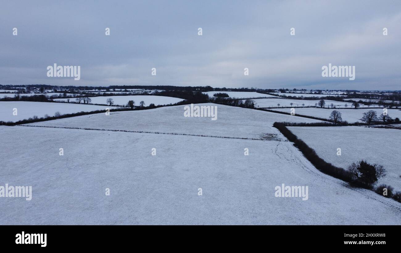 Aerial shot of the landscape with fields and roads fully covered with ...