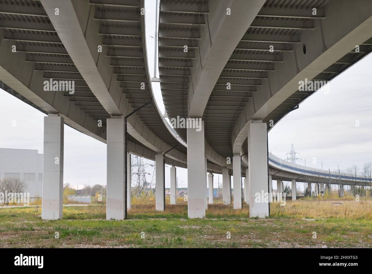 Automobile overpass on concrete supports. Modern road infrastructure ...