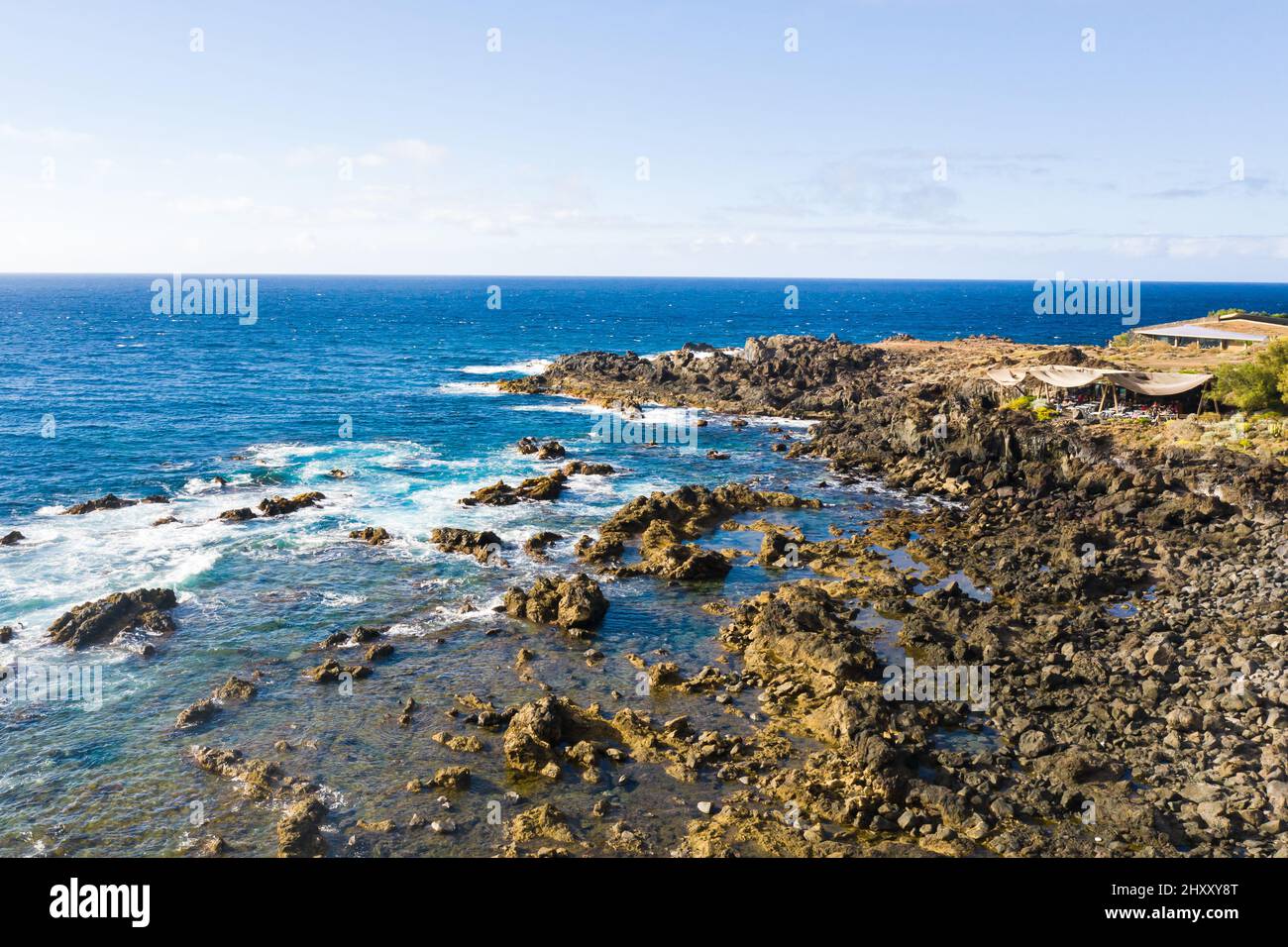 Rough rocky cliffs in the North of Tenerife.Black beach in the Canary ...