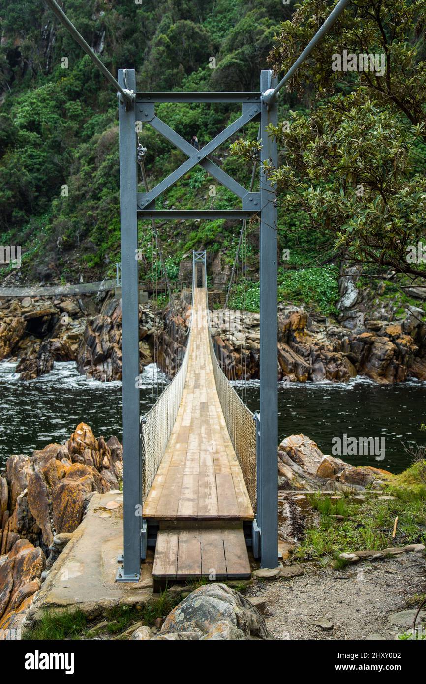 Shot of nerrow bridge going above river Stock Photo - Alamy