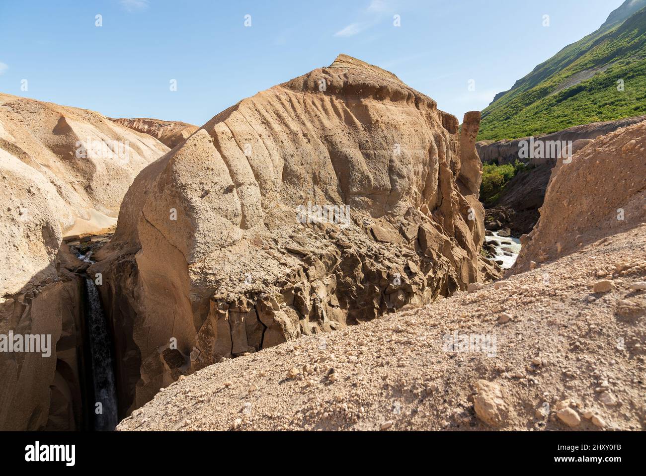 Natural view of cliff and water flowing in the Katmai National Park in ...