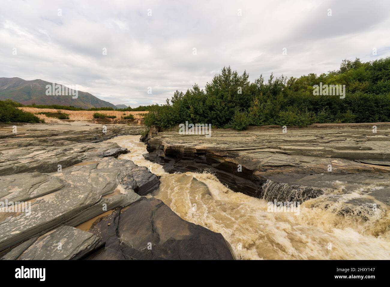 Natural view of cliff and water flowing in the Katmai National Park in ...