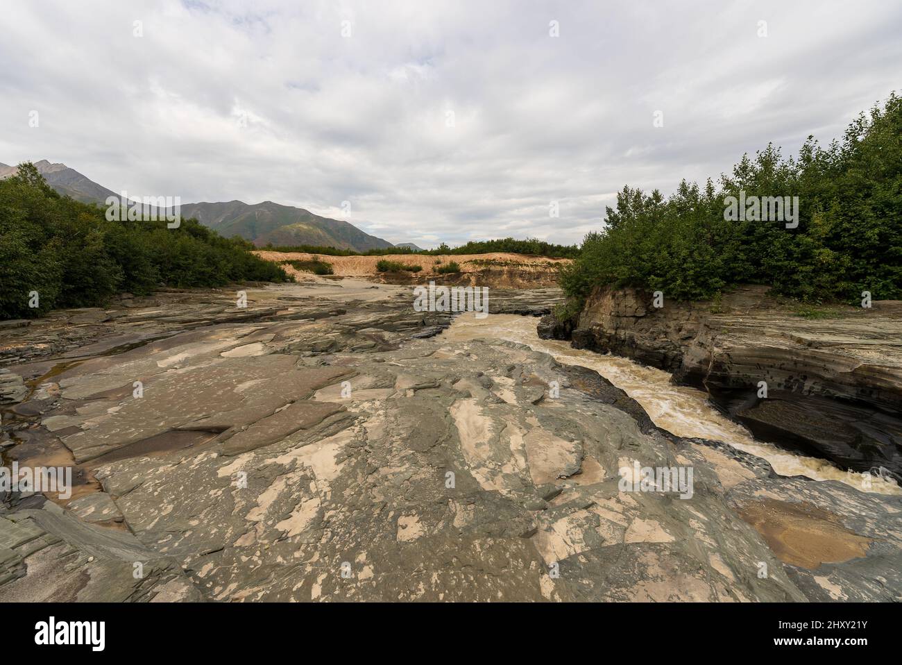 Natural view of cliff and water flowing in the Katmai National Park in ...