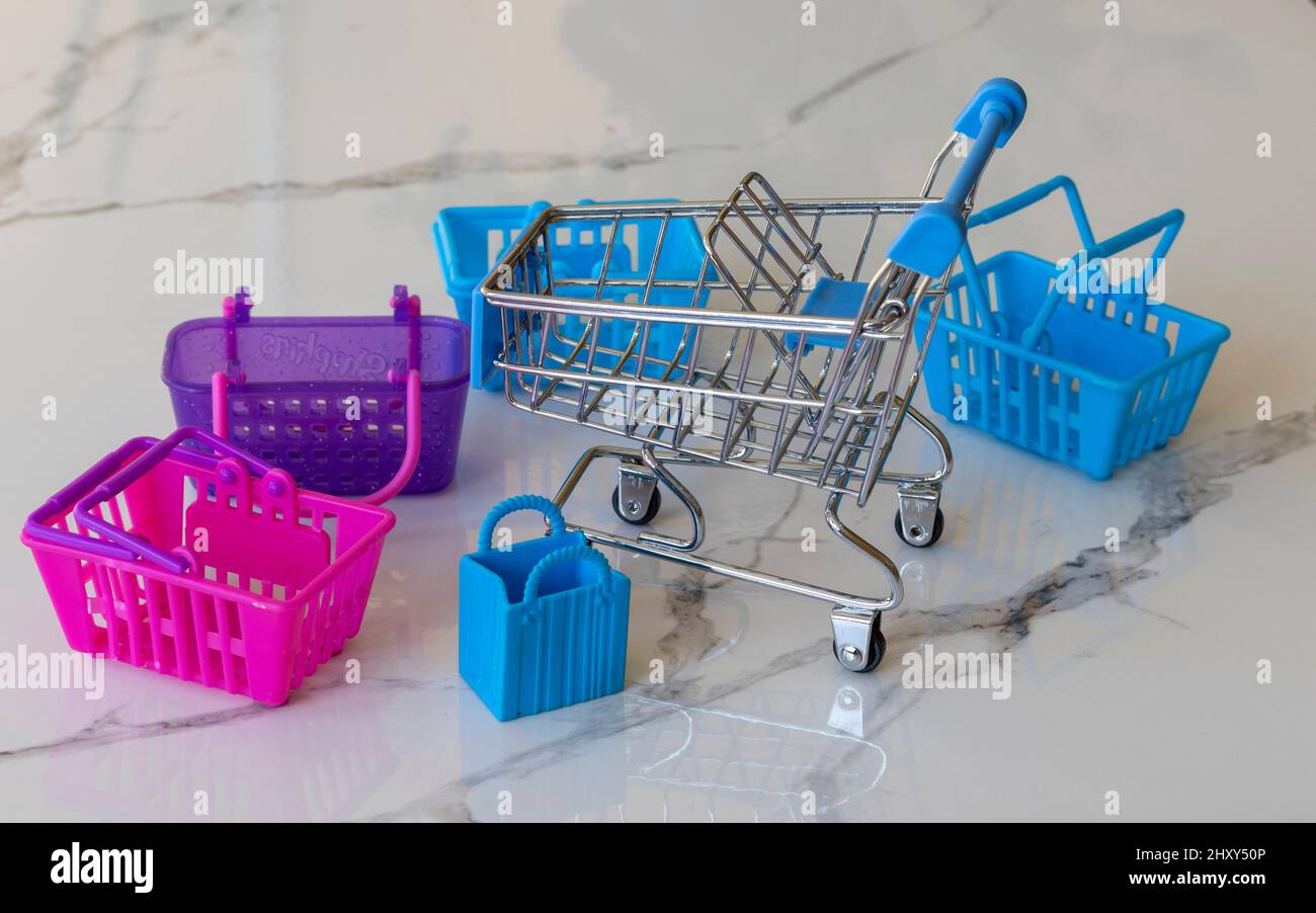 Tiny small empty shopping bags and mini cart Stock Photo - Alamy