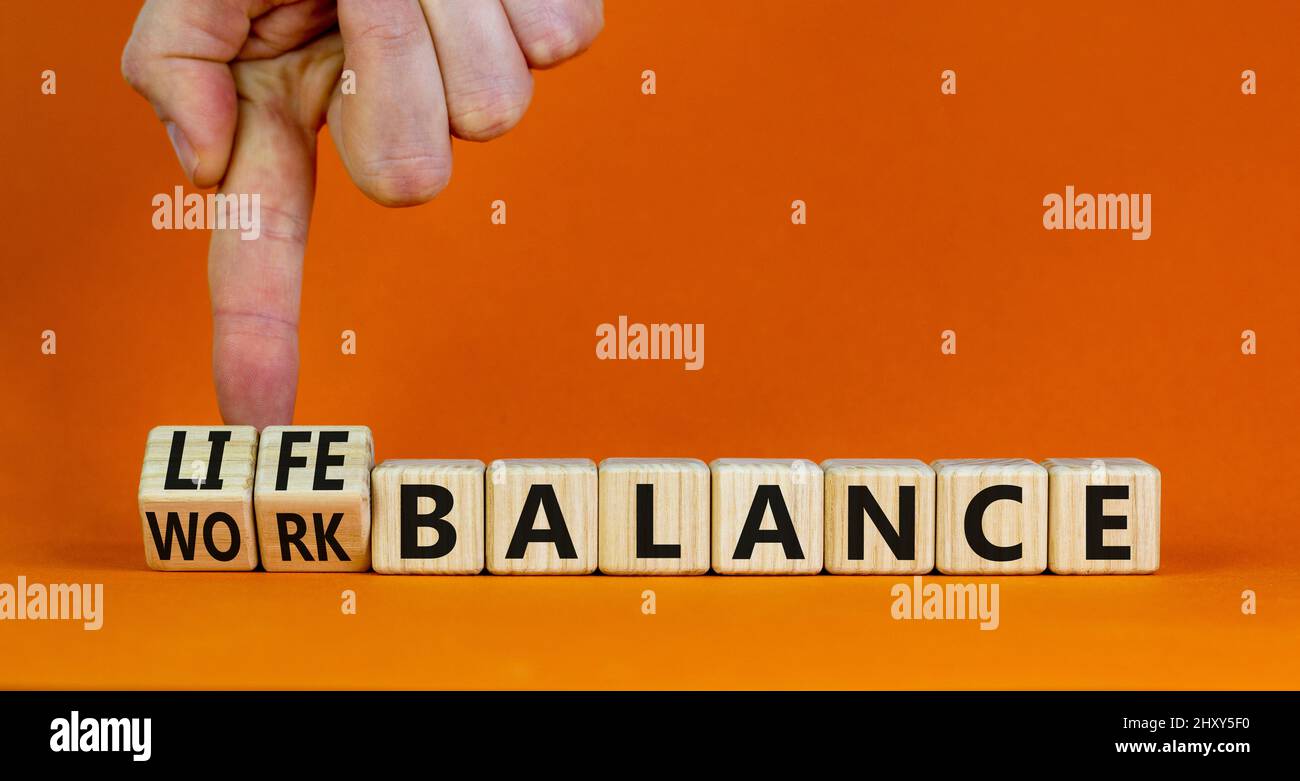 Work life balance symbol. Businessman turns cubes and changes concept ...