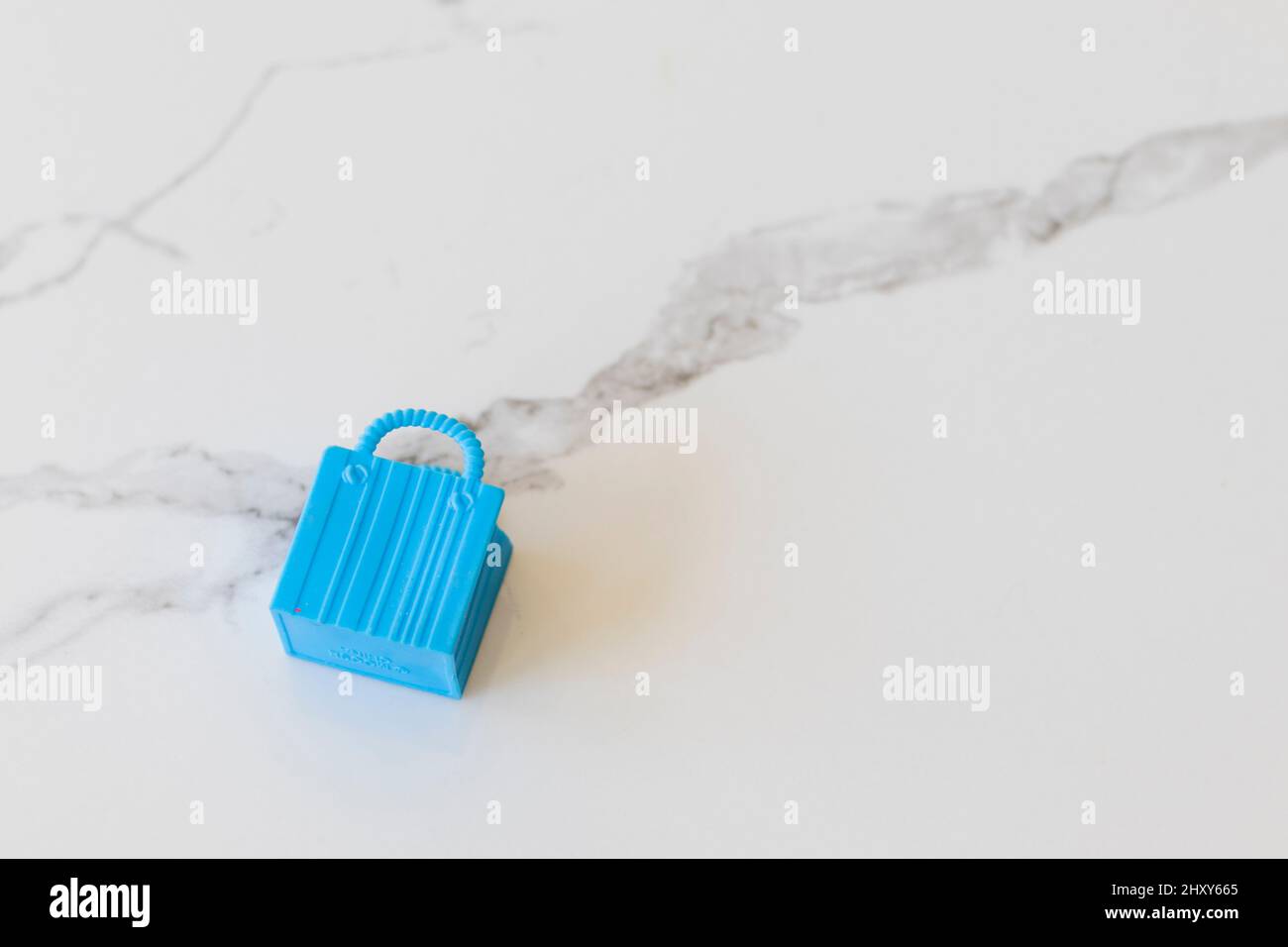 Blue mini rubber shopping bag with copy space Stock Photo - Alamy