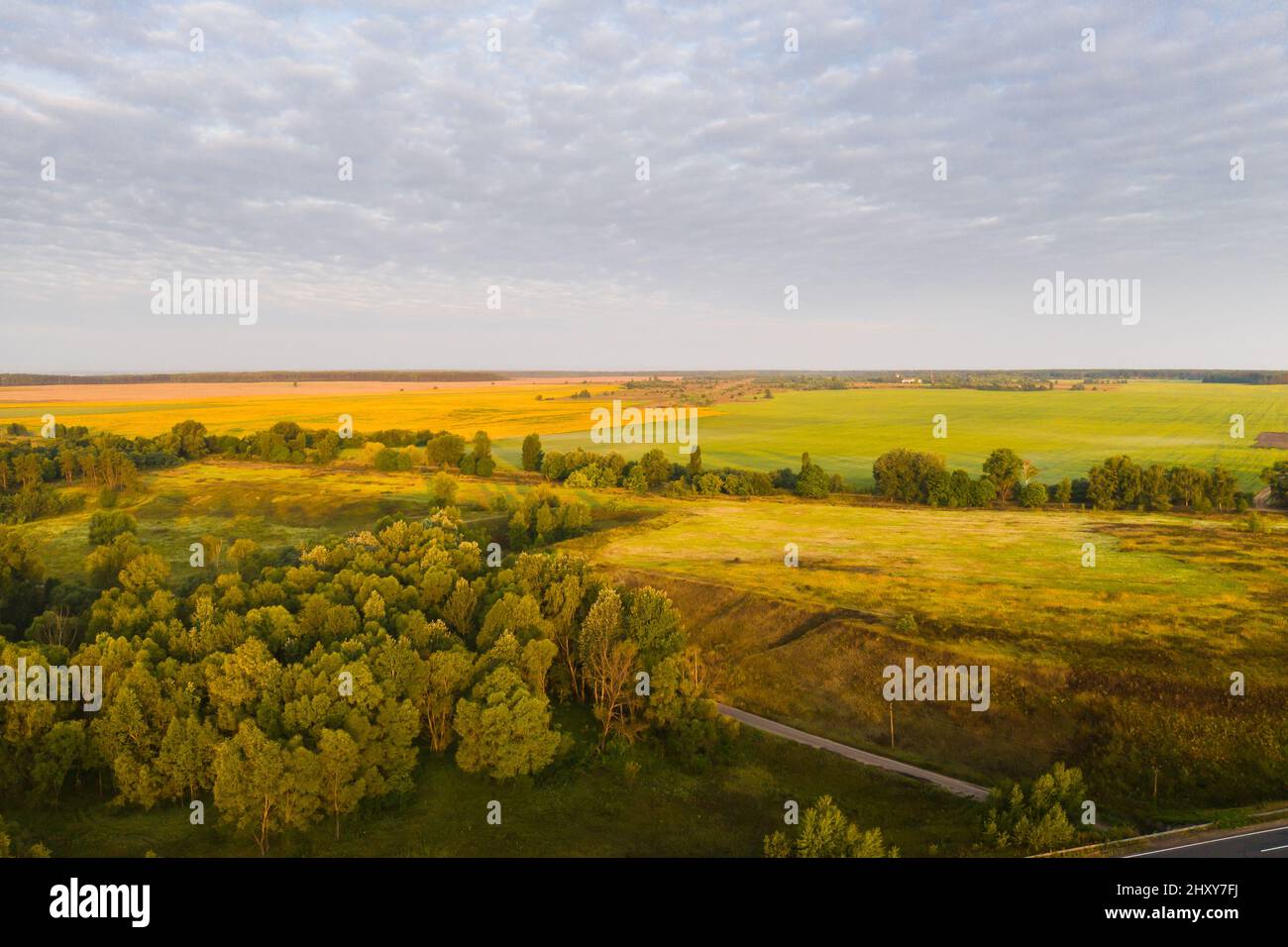 amazing sunrise in the countryside over forests and fields in Ukraine ...