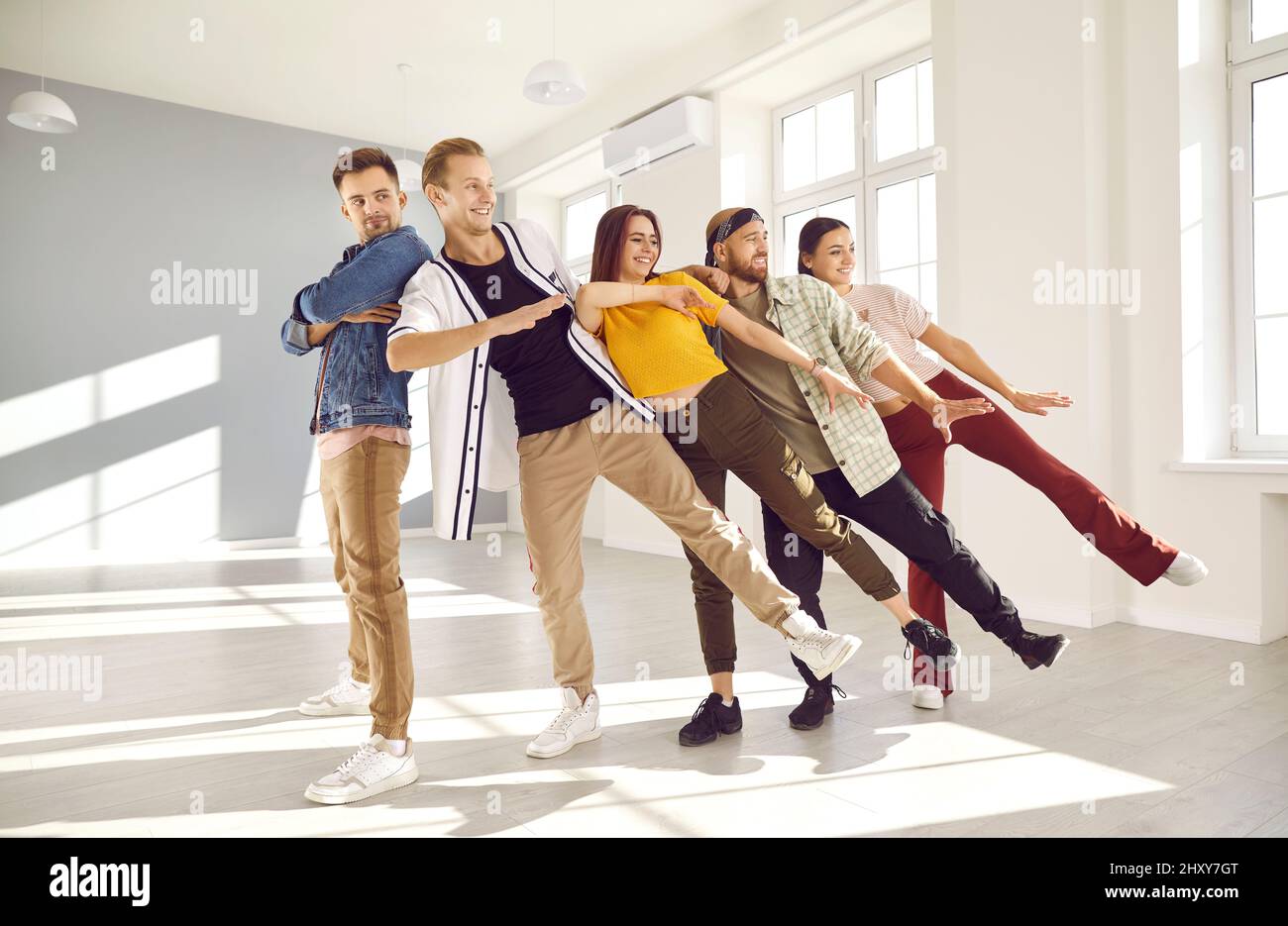 Group of happy young dancers and friends having fun while dancing ...
