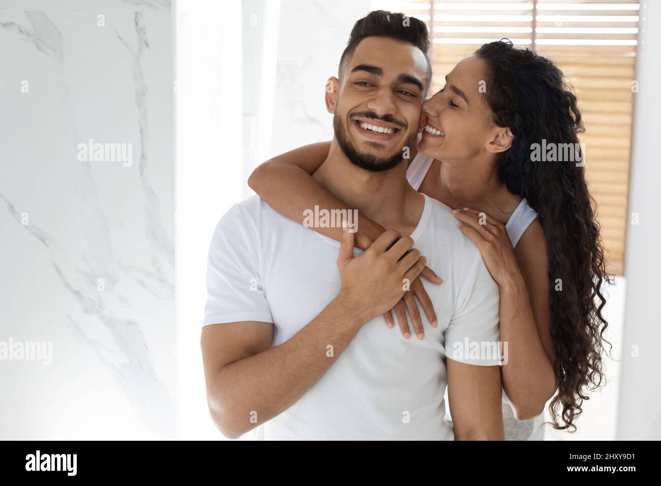 Happy Couple In Bathroom Having Fun Together While Getting Ready In ...