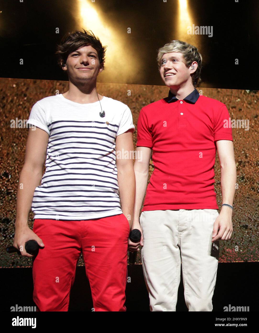 Louis Tomlinson and Niall Horan of One Direction performing live in ...