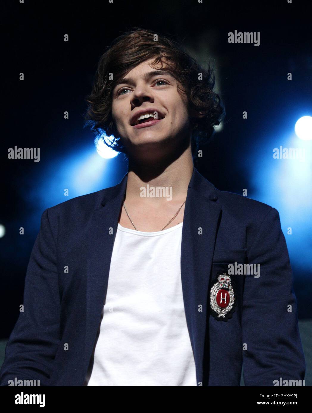 Harry styles one direction performing hi-res stock photography and ...