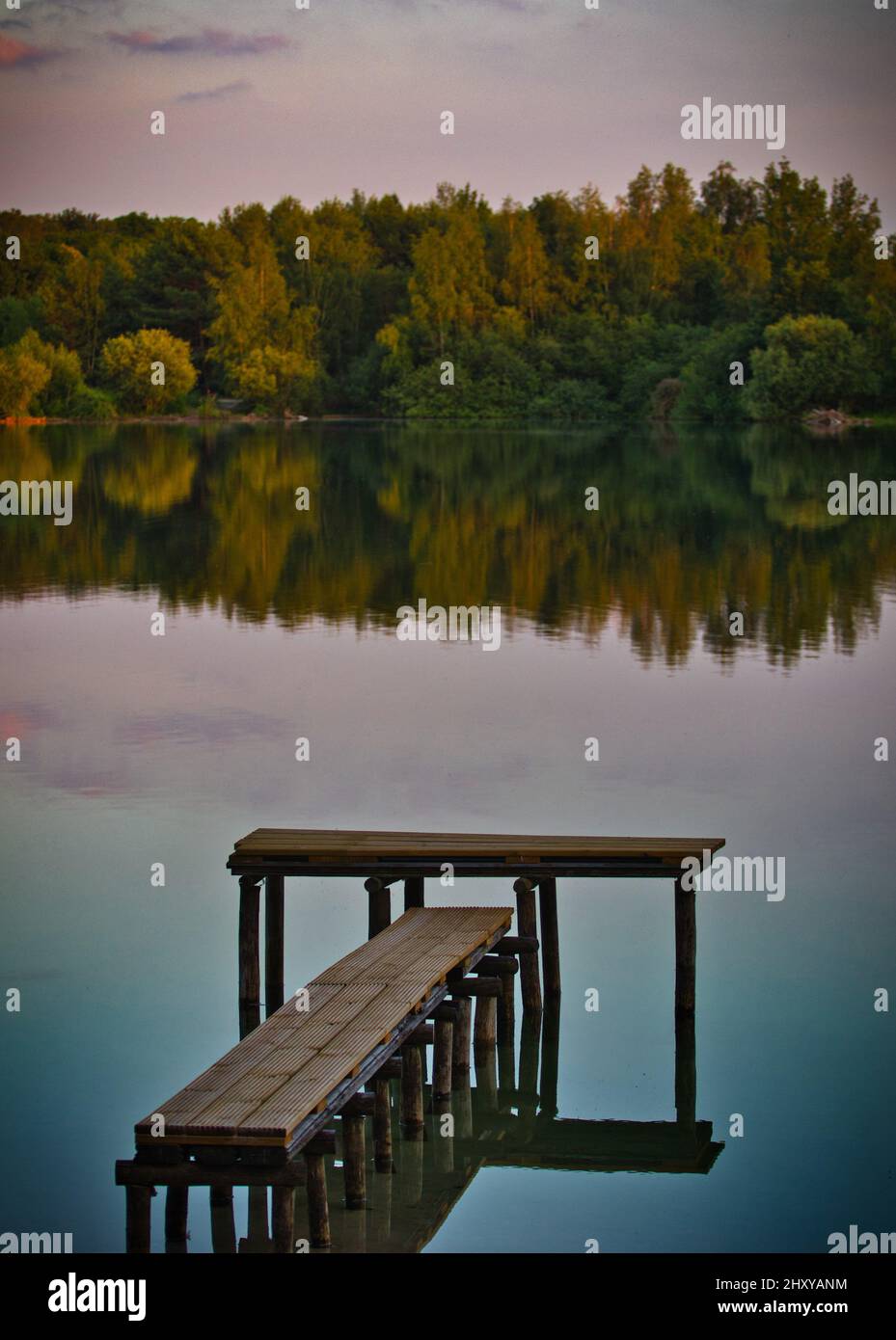 Shot of a small pathway on water with autumn trees Stock Photo - Alamy