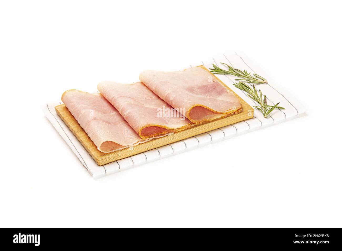 Wooden plank with thin slices of meat isolated on the white background ...