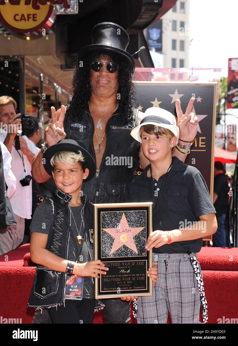 Musician Slash, sons Cash Hudson and London Hudson attending a ceremony ...