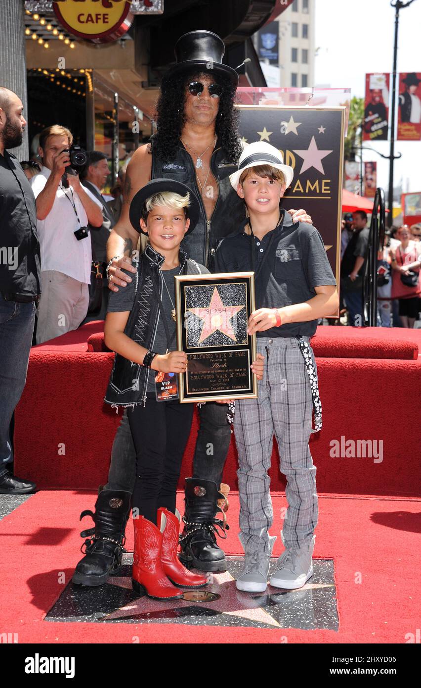 Musician Slash, sons Cash Hudson and London Hudson attending a ceremony ...