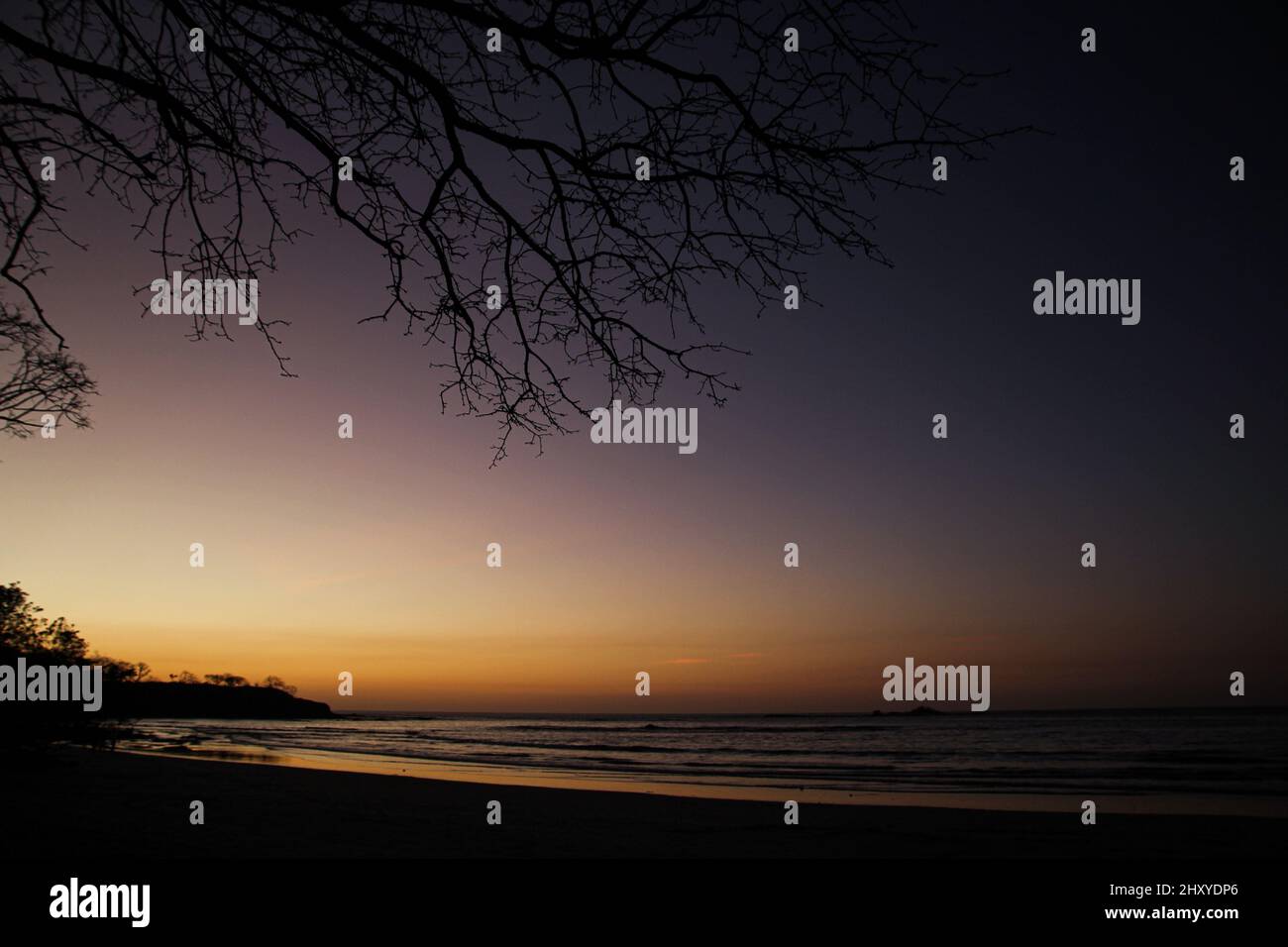 Landscape of a beach during the sunset Stock Photo - Alamy
