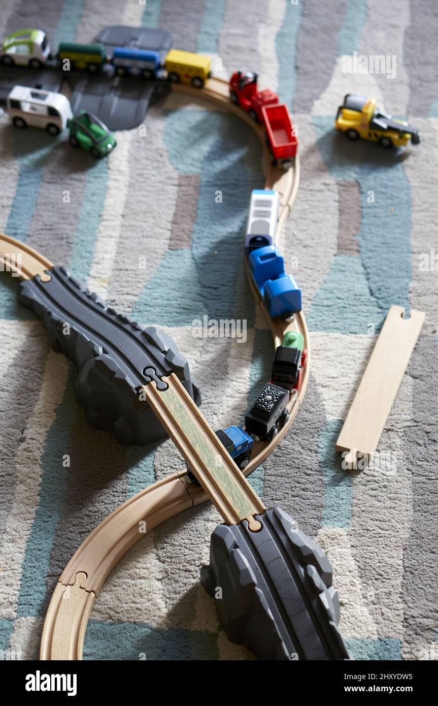 Vertical shot of the collection of plastic toy trains and locomotives ...