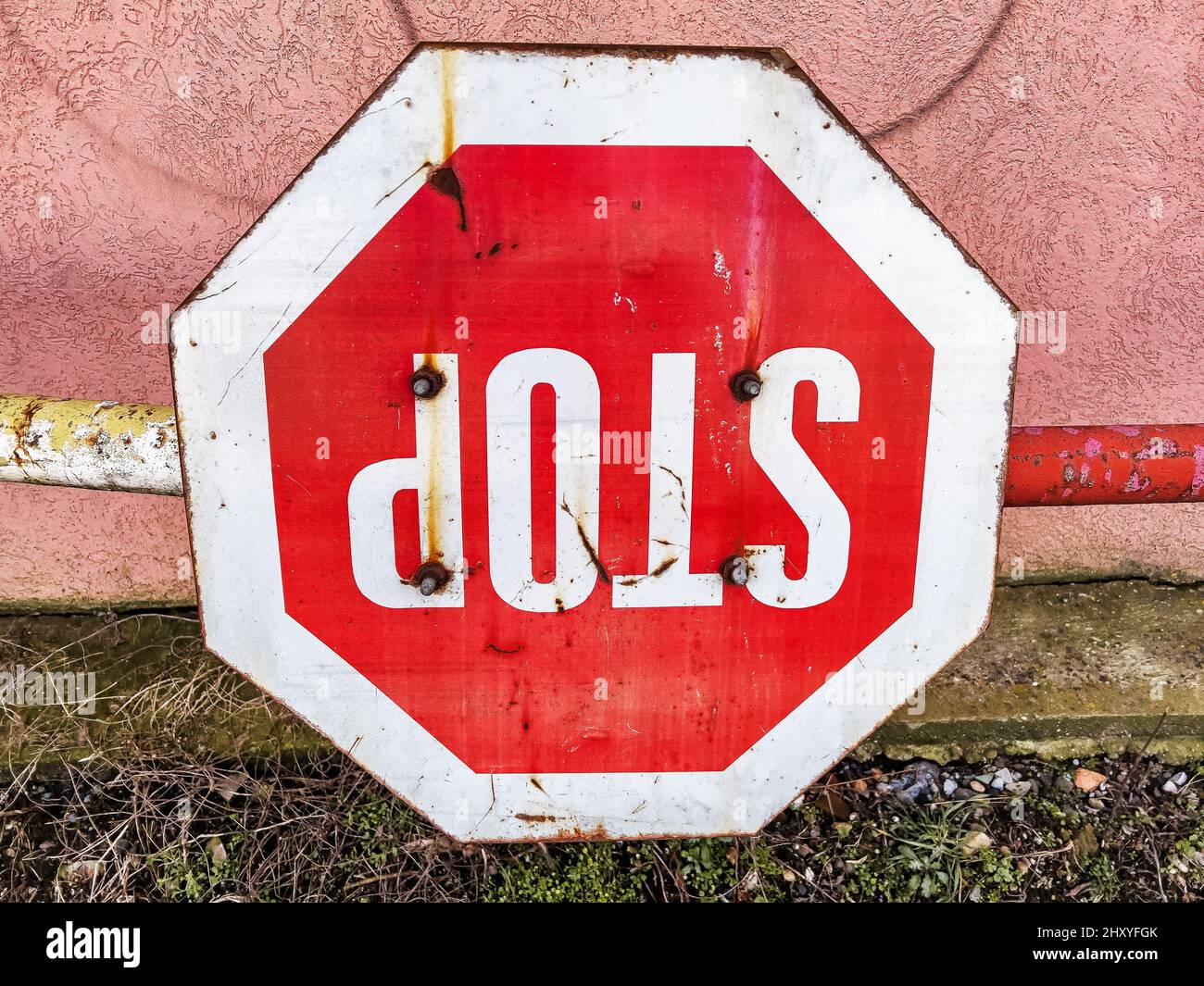 Closeup of an upside-down stop sign Stock Photo - Alamy