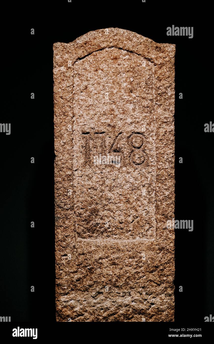 Vertical shot of a sculpture with numbers carved on it Stock Photo - Alamy