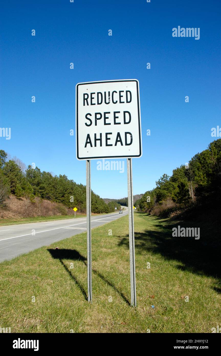 Freeway and road signs on the shoulder of the roadway bed Stock Photo ...