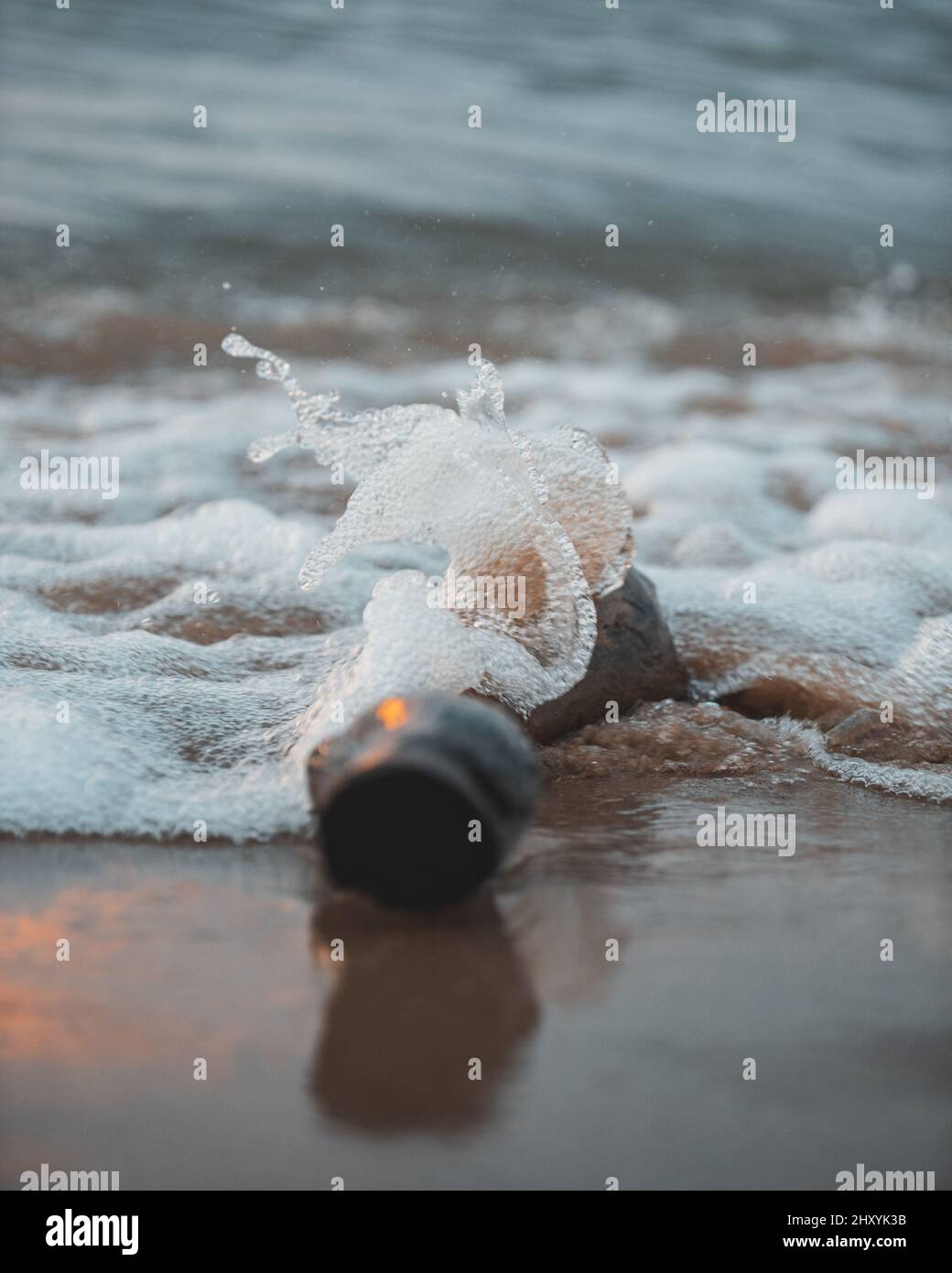Selective of wave splashes on the beach in Michigan Stock Photo - Alamy