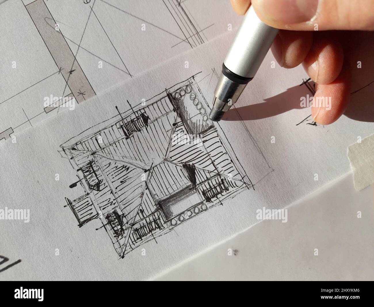 Of a hand that draws on paper with a pencil Stock Photo - Alamy