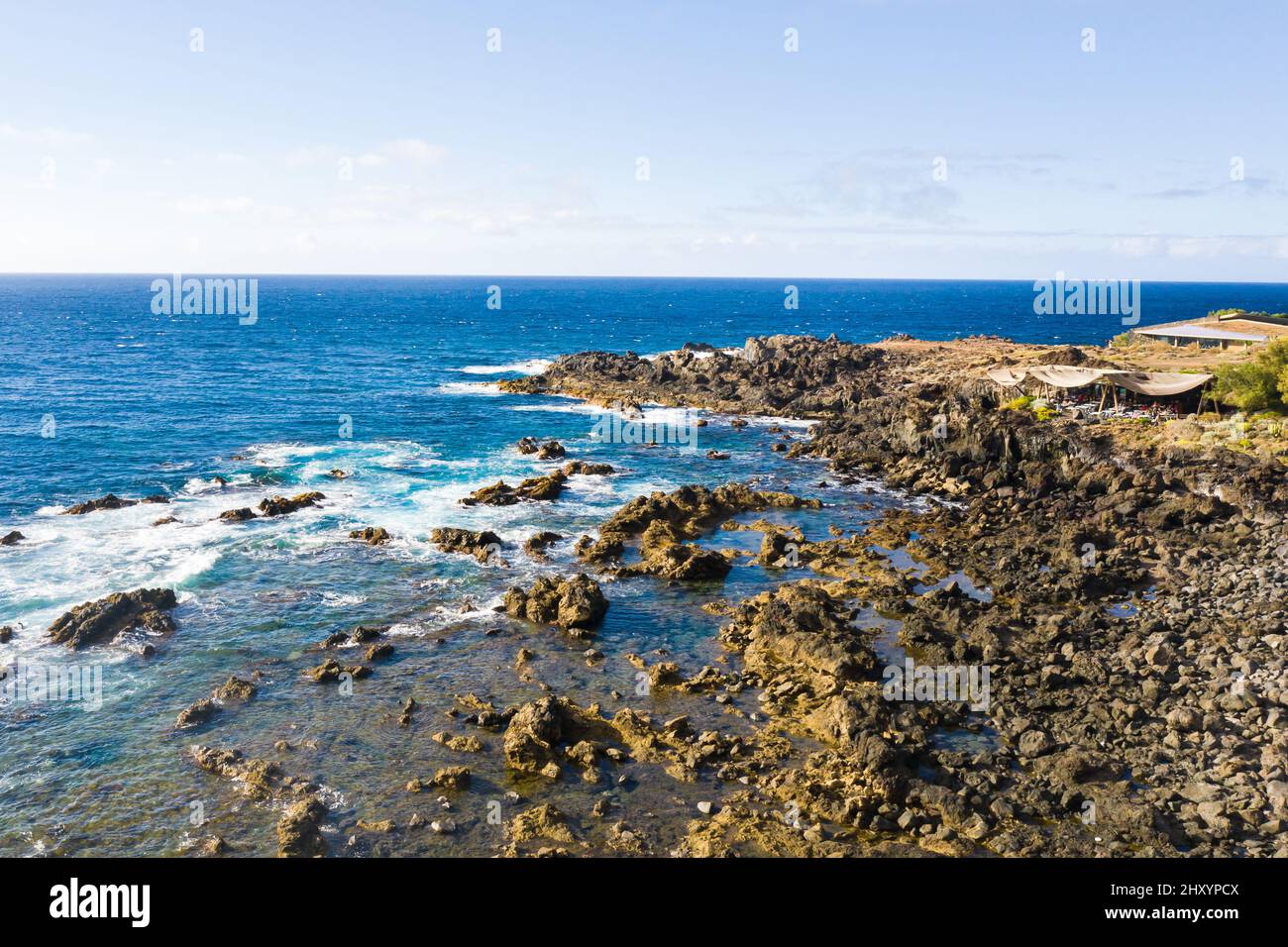 Rough rocky cliffs in the North of Tenerife.Black beach in the Canary ...