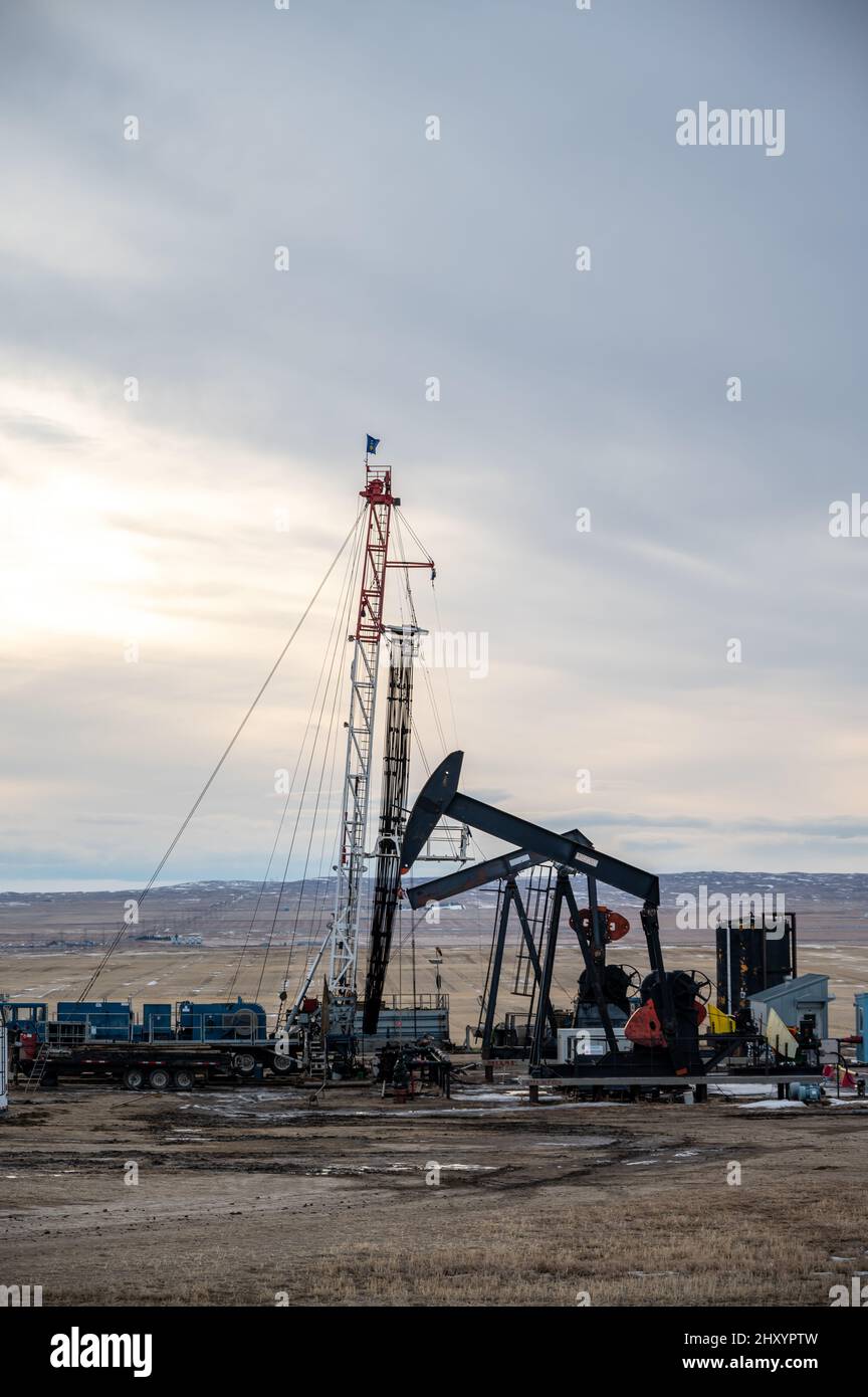 MIlo, Alberta - March 12, 2022: Drilling rig and equipment at well site ...