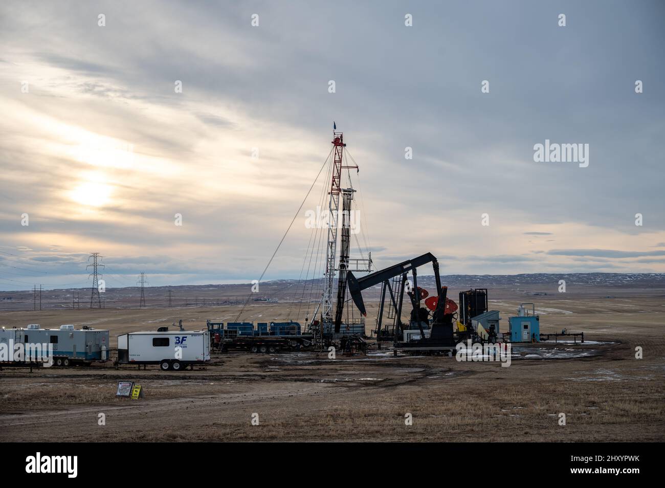 MIlo, Alberta - March 12, 2022: Drilling rig and equipment at well site ...