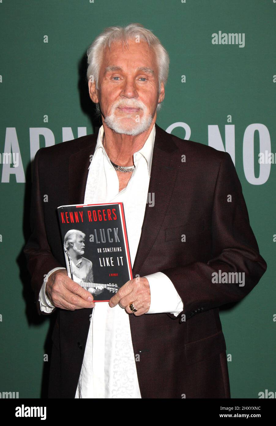 Kenny Rogers signs copies of his book "Luck Or Something Like It" at ...