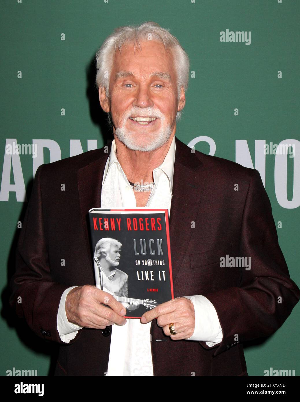 Kenny Rogers signs copies of his book "Luck Or Something Like It" at ...