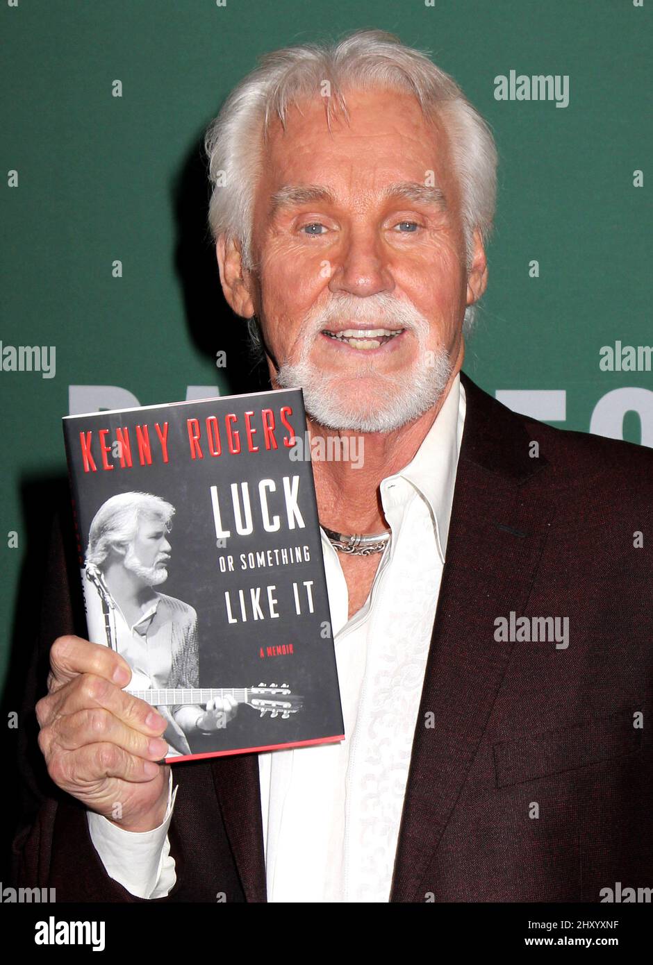 Kenny Rogers signs copies of his book "Luck Or Something Like It" at ...