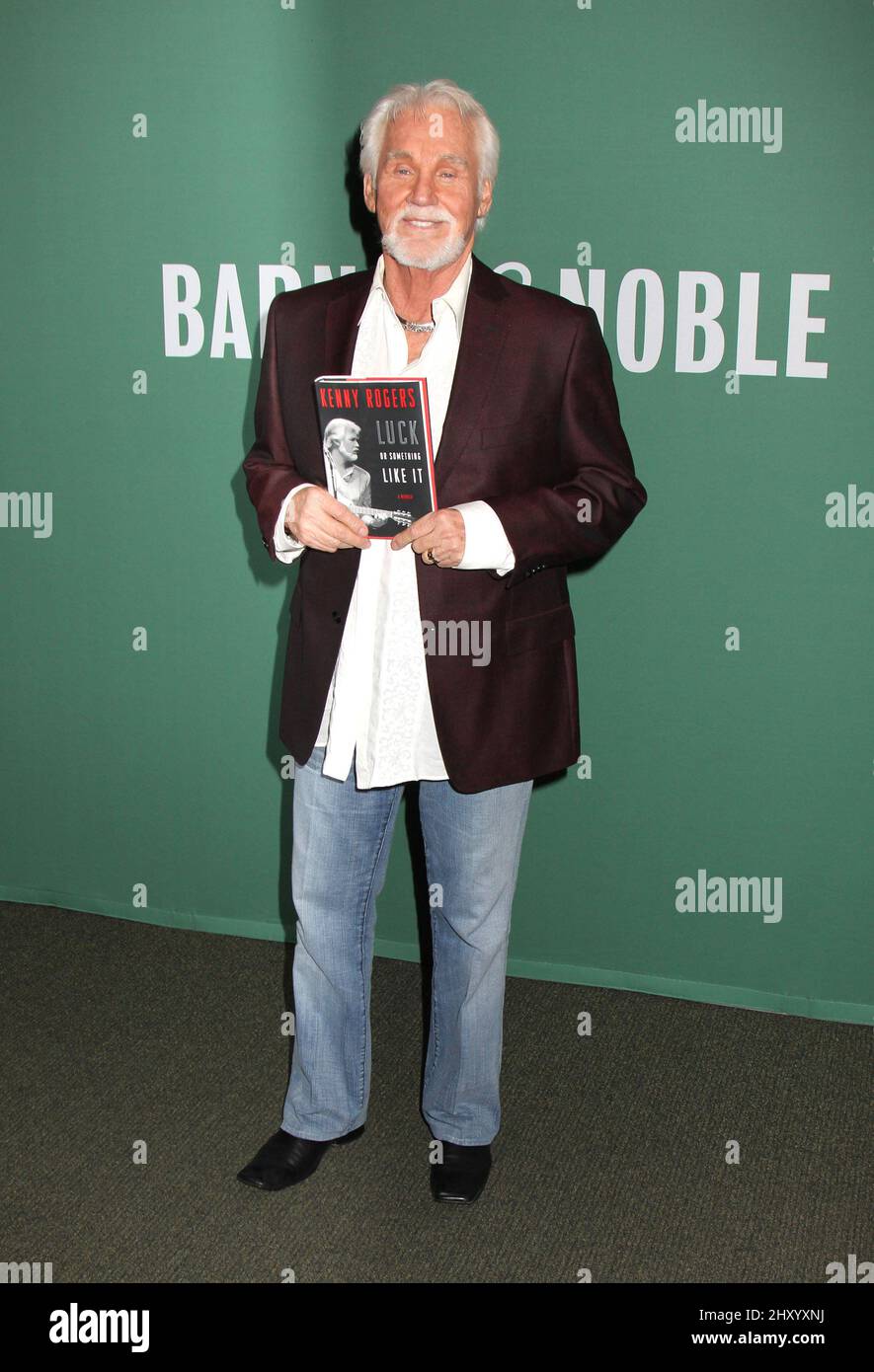 Kenny Rogers signs copies of his book "Luck Or Something Like It" at ...